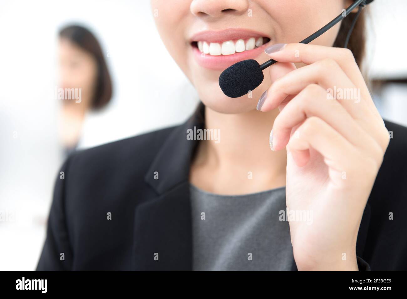 Woman agent talking mic hi-res stock photography and images - Alamy