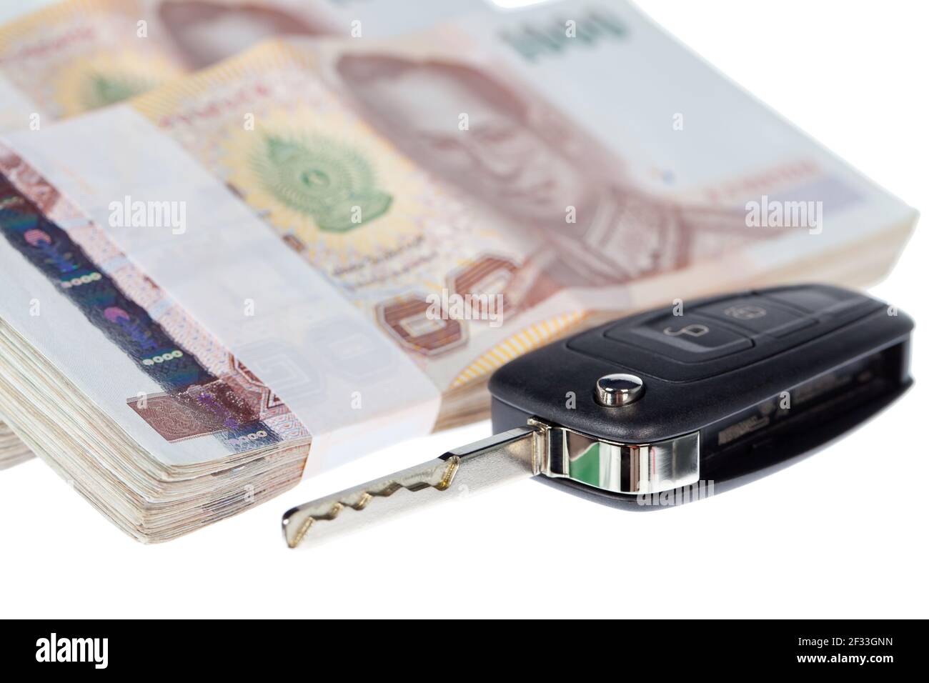 Close up car key and stacks of money thai baht Stock Photo - Alamy
