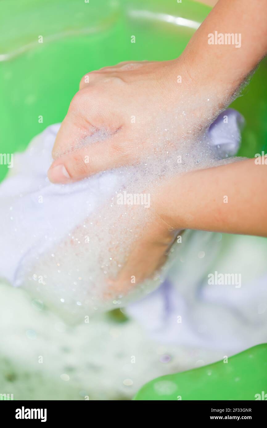 Close up hand washing in plastic bowl Stock Photo - Alamy