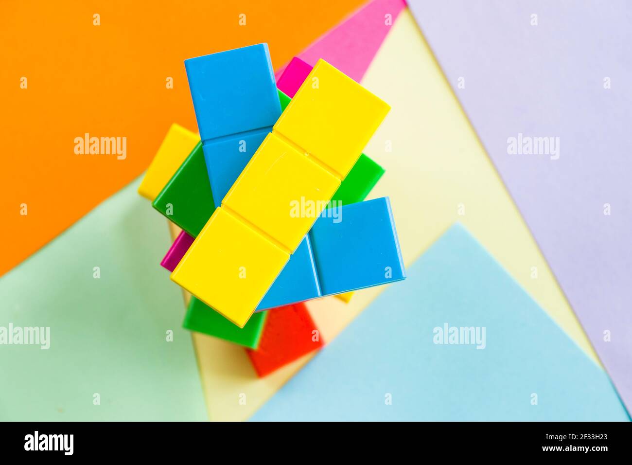 Colorful puzzle cubes background, geometric figures, table game ...