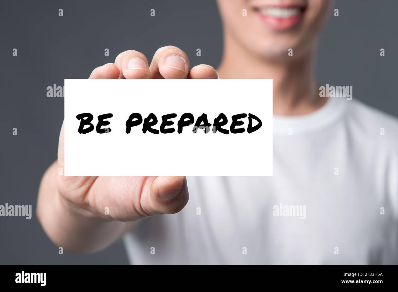 BE PREPARED, message on the card shown by a man Stock Photo - Alamy