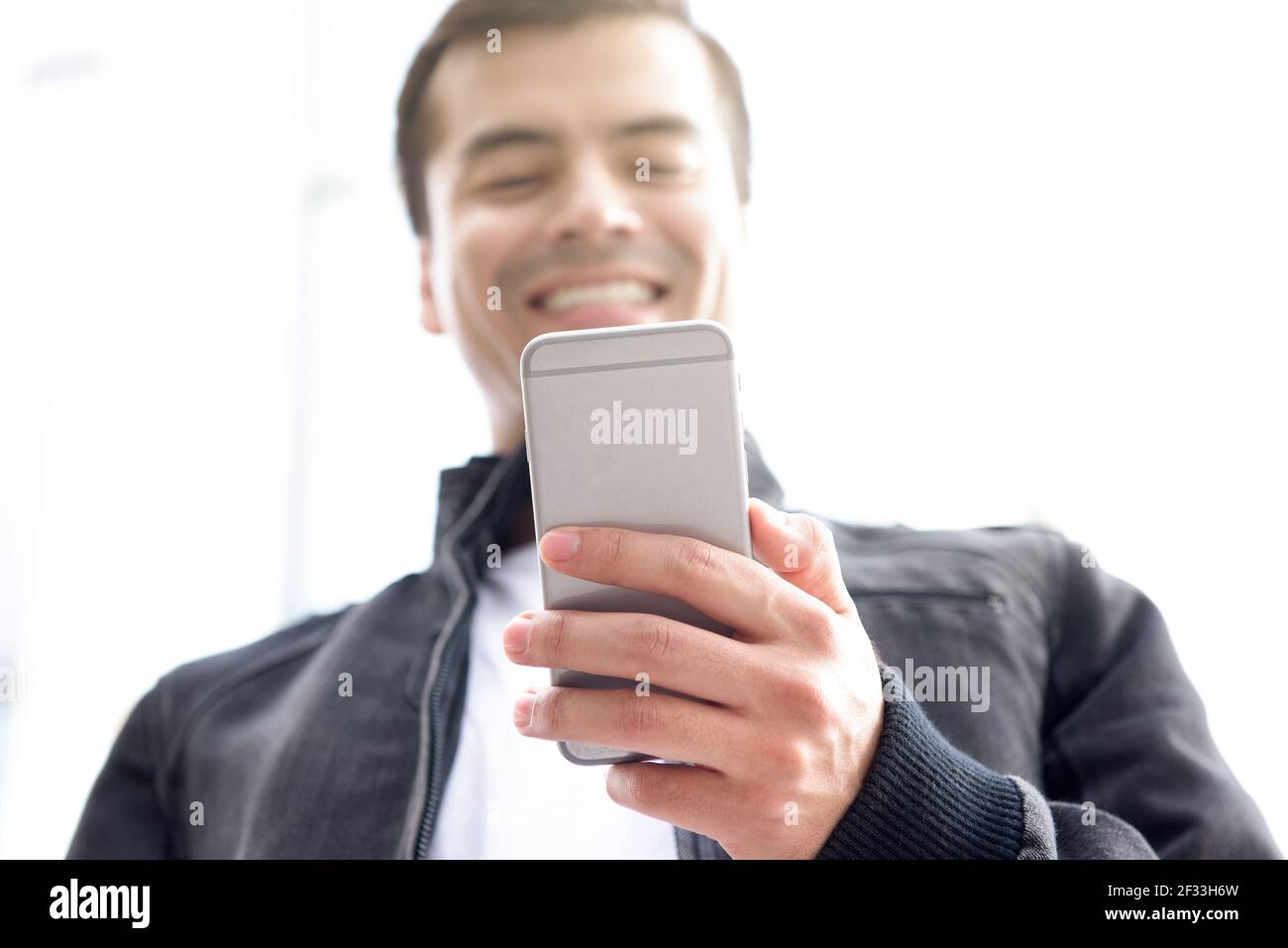 Handsome smiling man using hi-res stock photography and images - Alamy