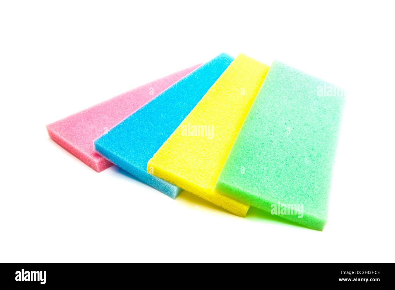 Colorful rectangular synthetic sponges for cleaning, on white ...