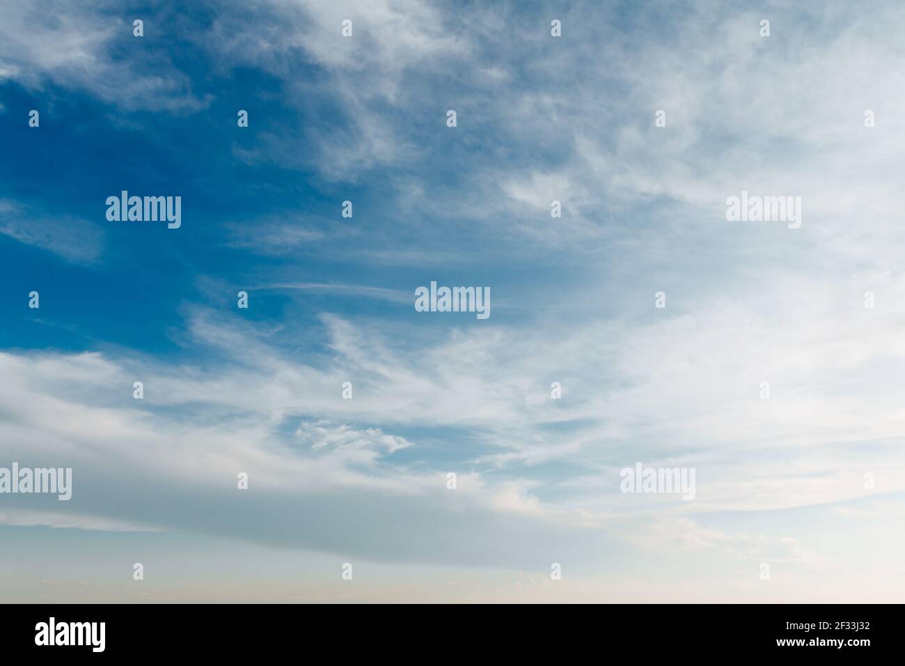 Beautiful blue sky with stretched white clouds Stock Photo - Alamy