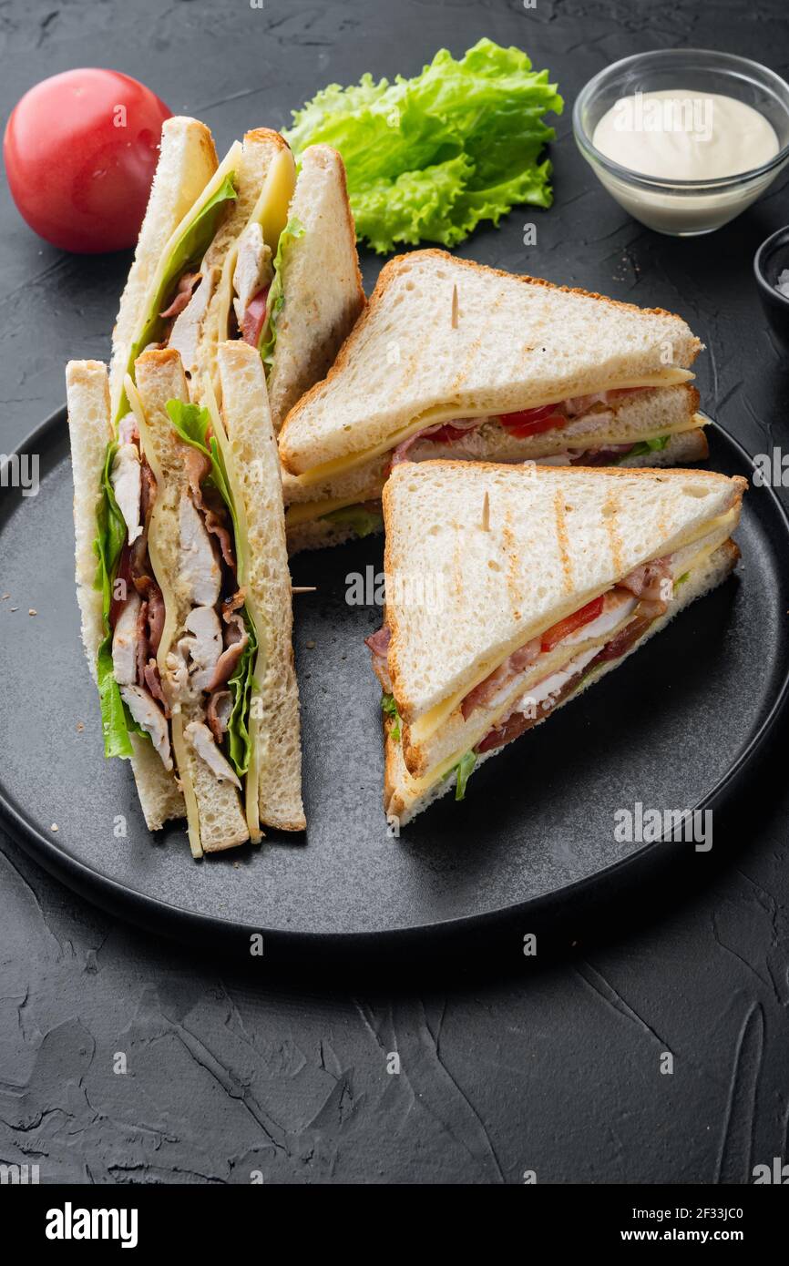 Deli fresh sandwich with chicken, on black background Stock Photo - Alamy