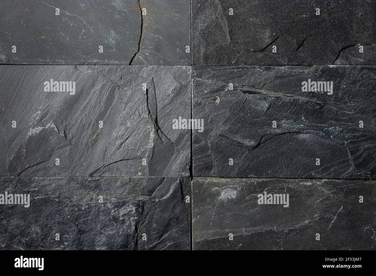A gray slate tiled wall texture background Stock Photo - Alamy