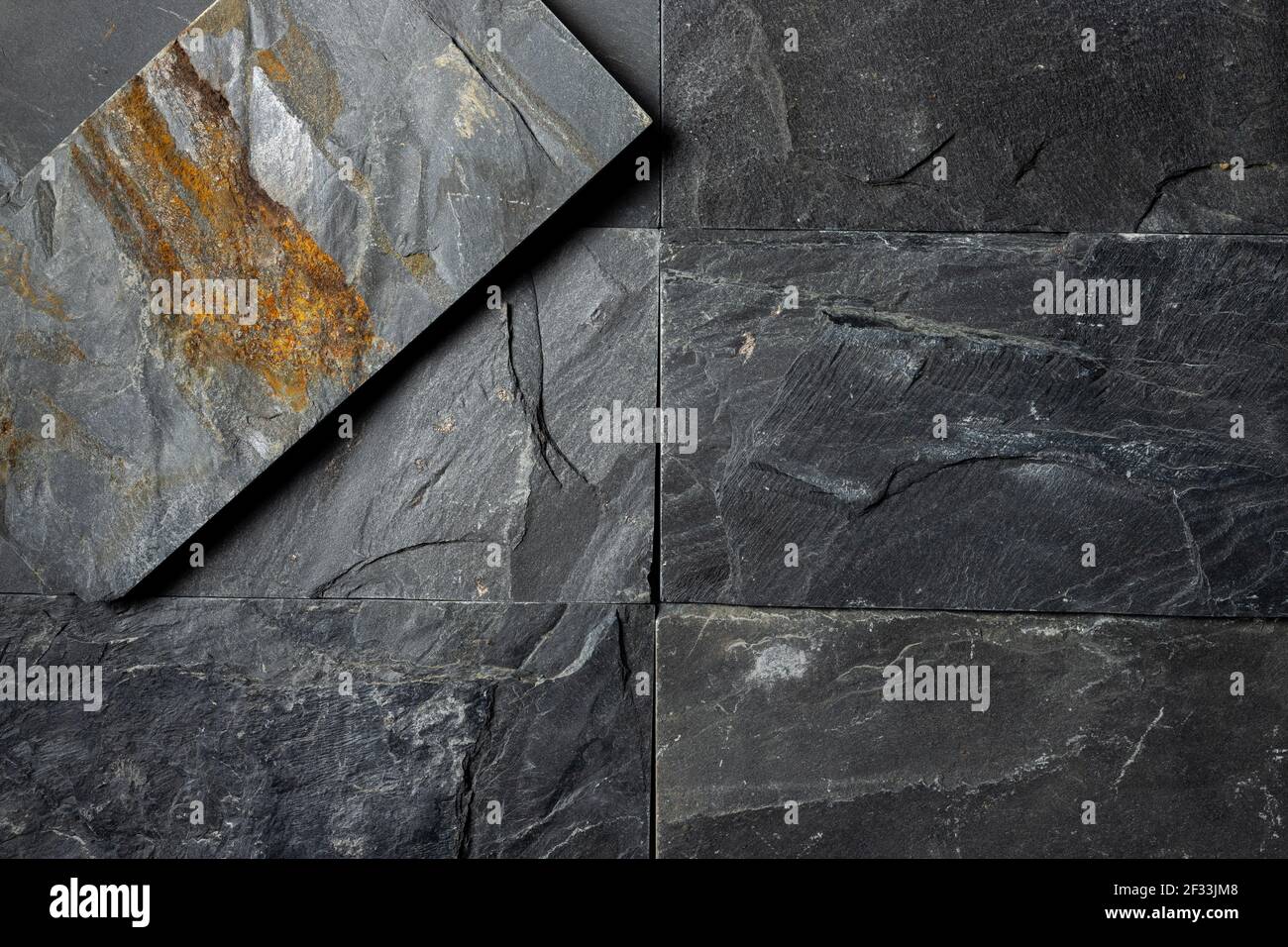 A gray slate tiled wall texture background Stock Photo - Alamy