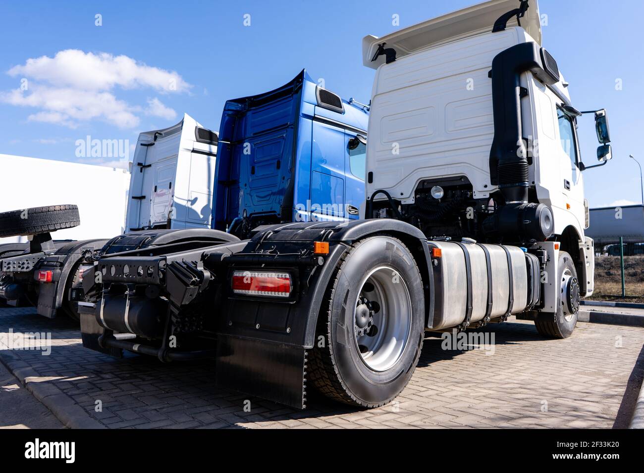 Truck fleet at the logistics center Stock Photo - Alamy