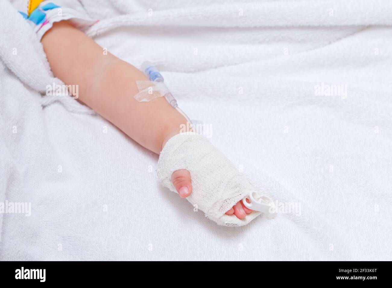 Saline intravenous (IV) on baby hand,shallow depth of field (DOF ...