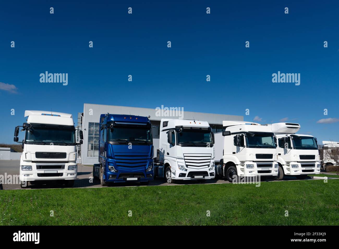 Truck fleet at the logistics center Stock Photo - Alamy