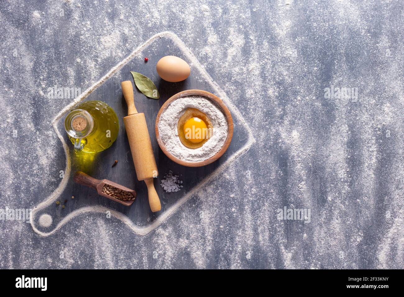 Scattered flour powder and bakery ingredients for homemade bread baking ...