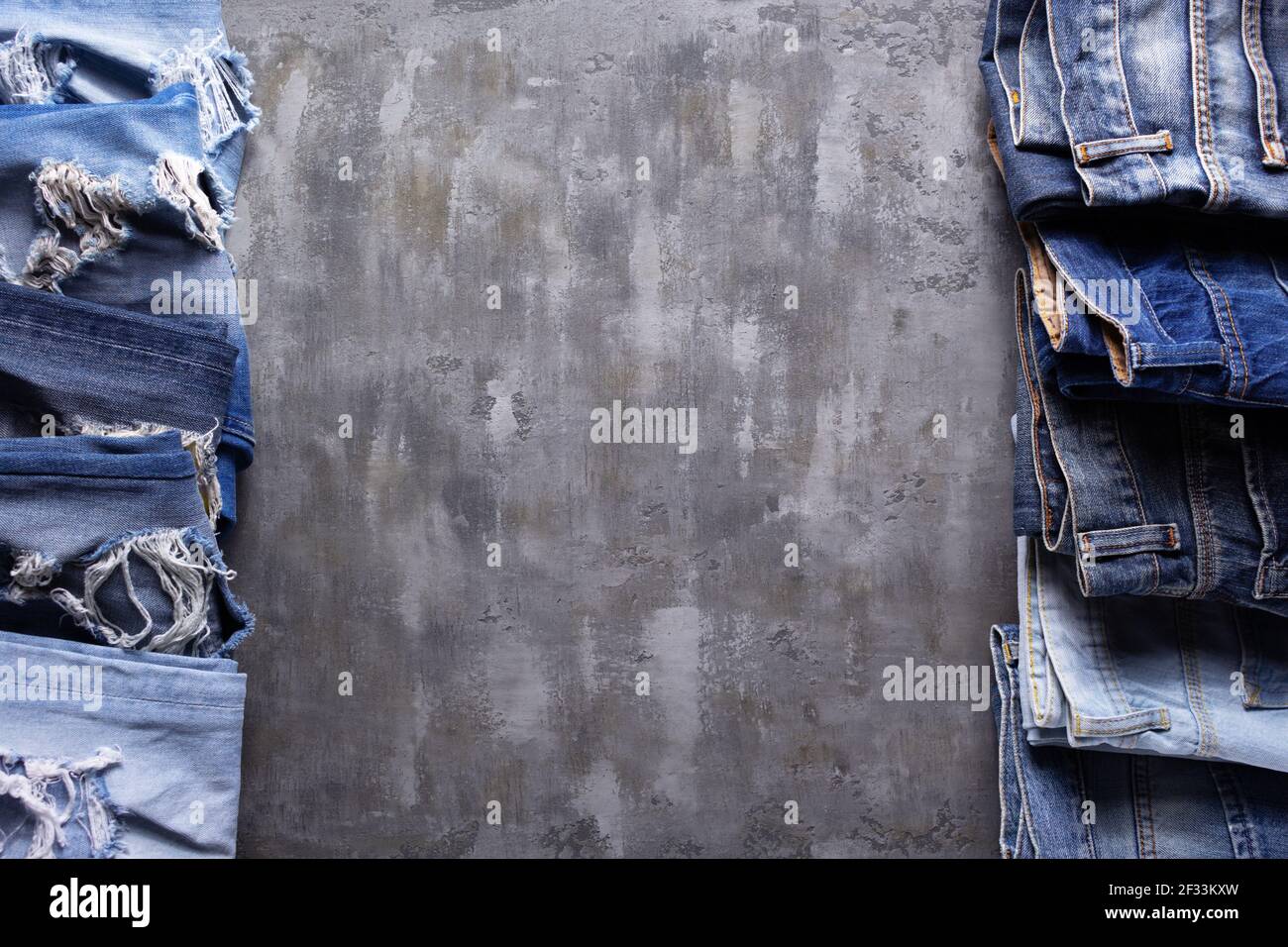 Denim jeans on old abstract background texture of table surface Stock ...