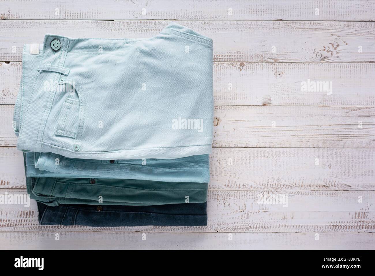 Denim jeans on old wooden background texture table surface. Top view ...