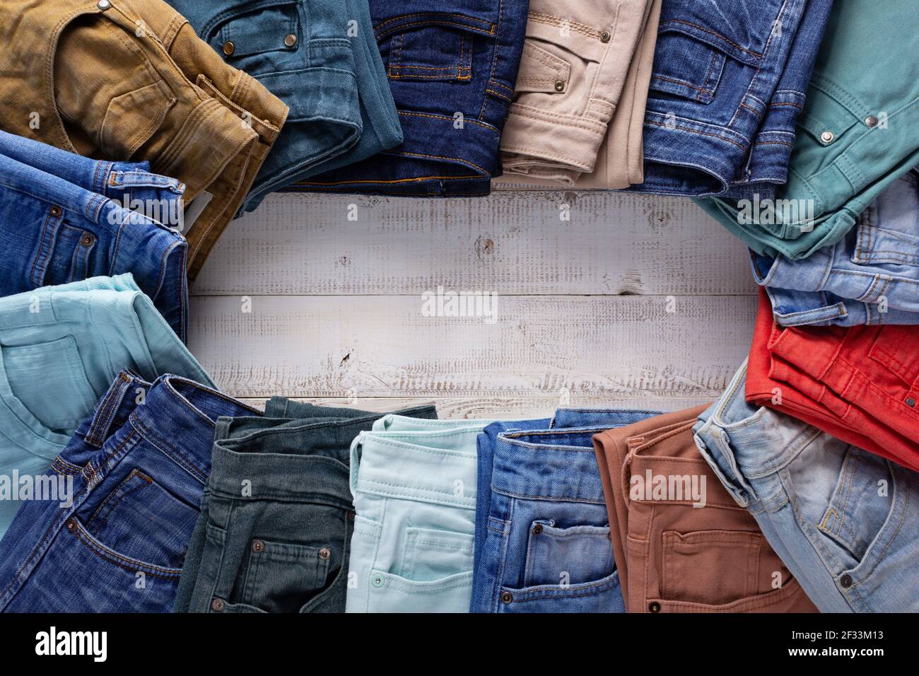 Denim jeans on old wooden background texture table surface. Top view ...