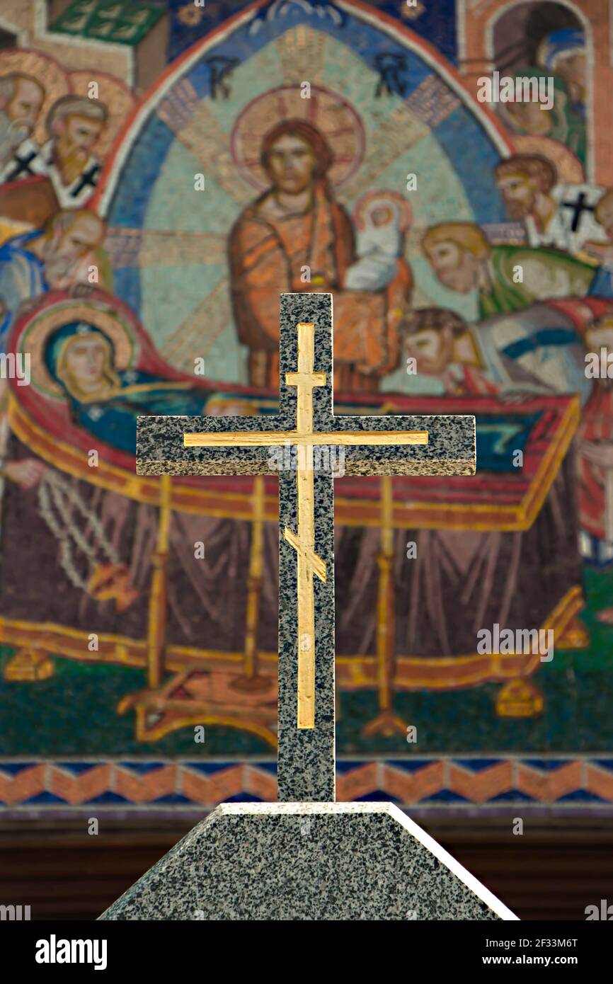 Small stone cross on the background of biblical mosaics Stock Photo - Alamy