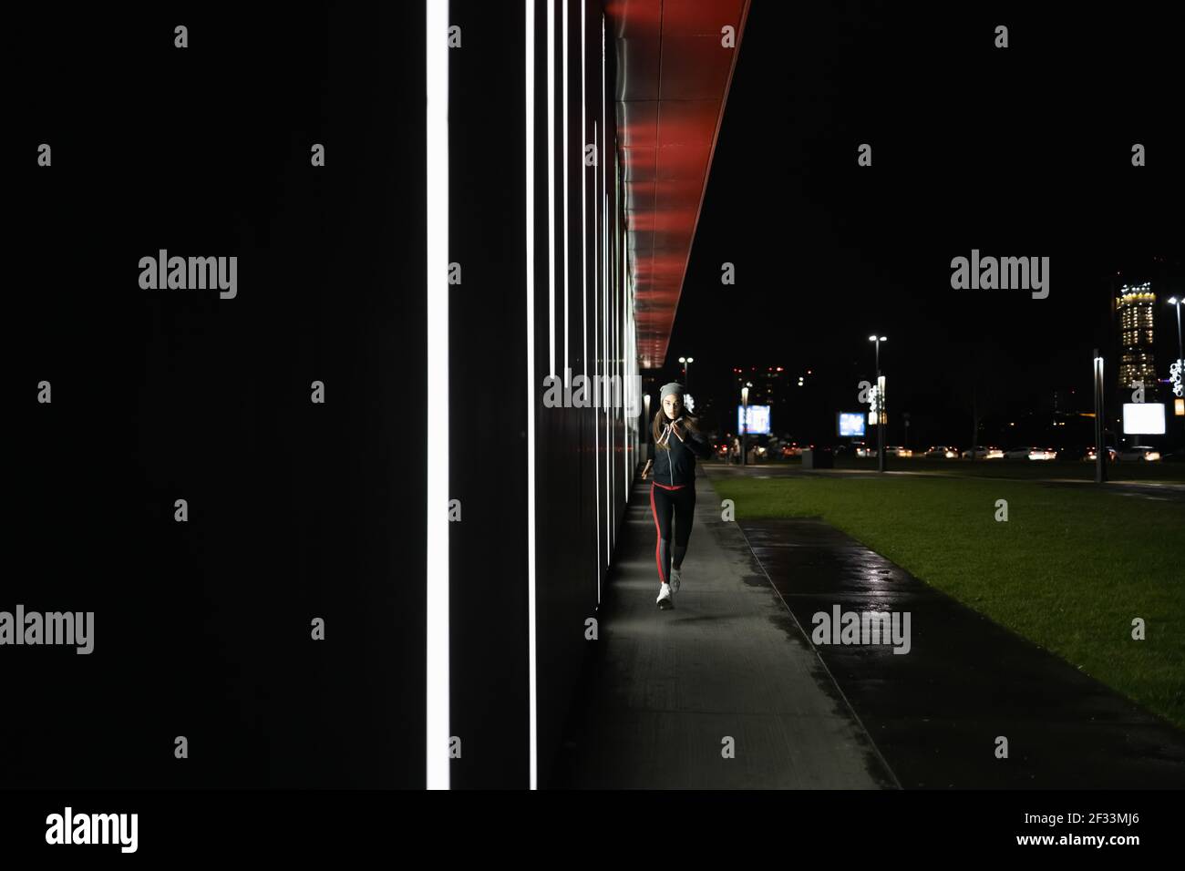 Woman running through the city hi-res stock photography and images - Alamy