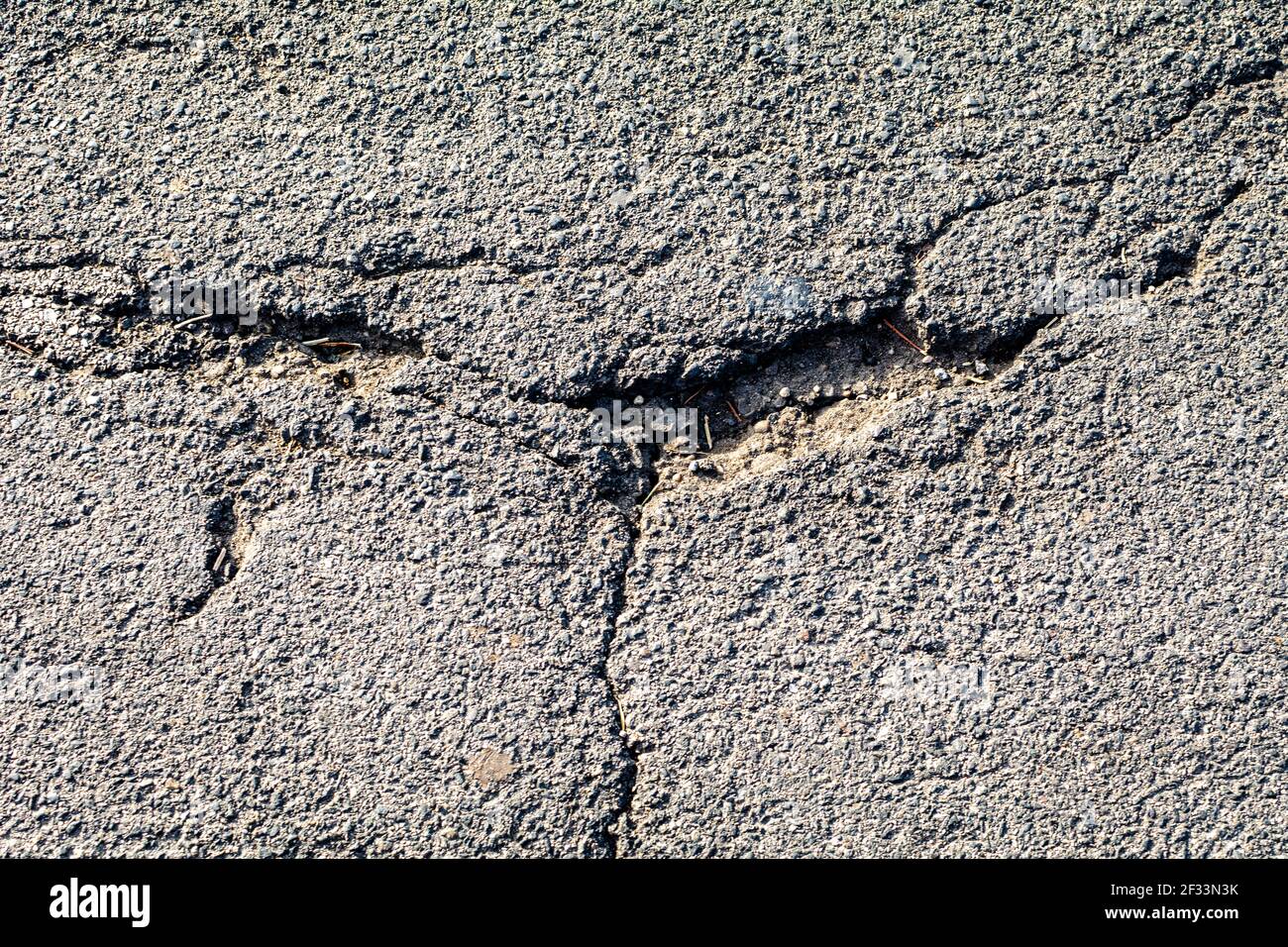 Cracked asphalt surface texture. Road or sidewalk pothole, broken ...