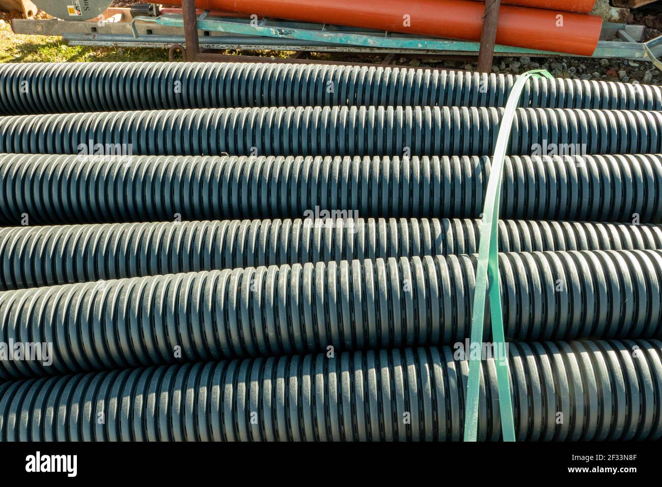 Plastic pipes with grooves on the construction site Stock Photo - Alamy