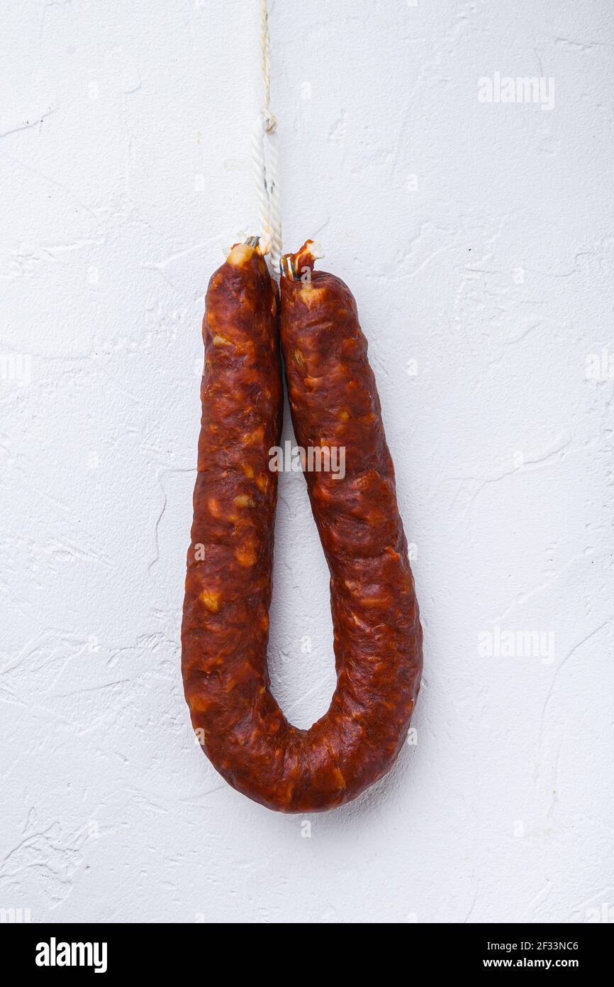 Dry cured chorizo sausage on white background, topview Stock Photo - Alamy