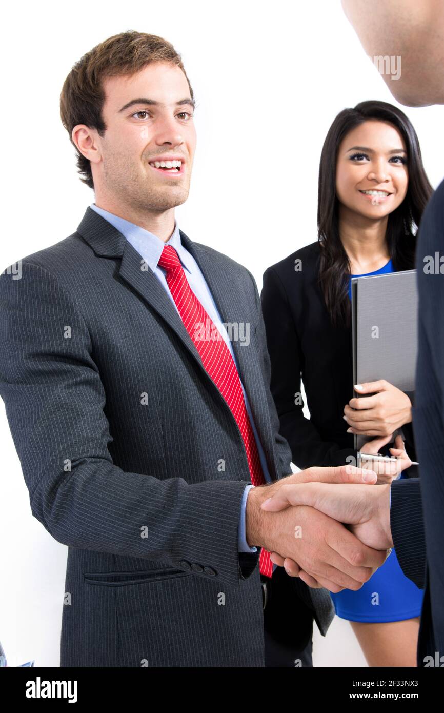 Businessmen making handshake Stock Photo - Alamy