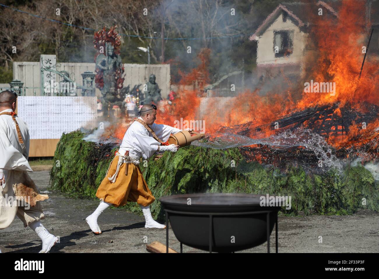 A monk floods the flame with water.The Fire Walking Festival is held ...