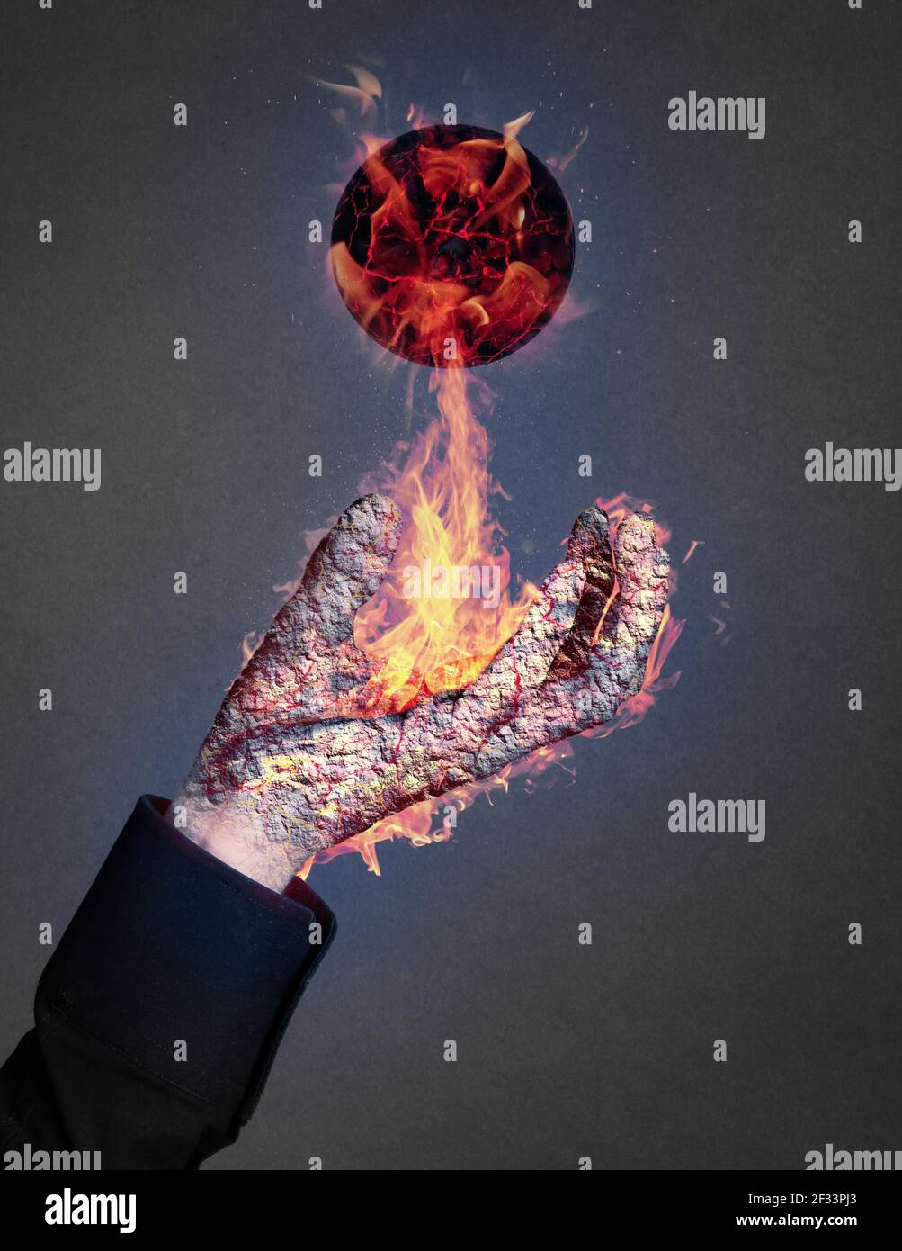 Hand magically burning, with floating burning ball - Concept of power ...