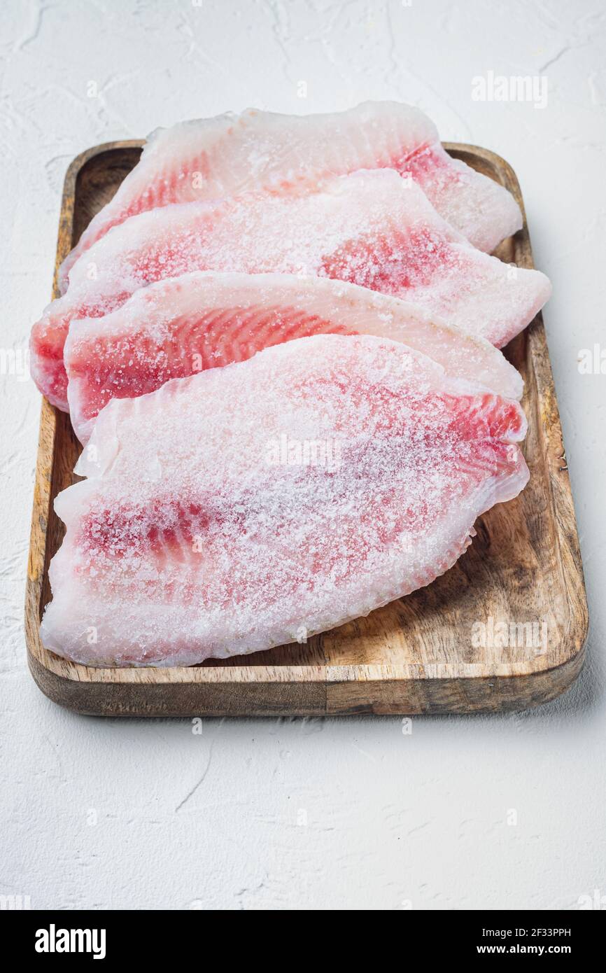 Frozen fish fillet set, on white background Stock Photo - Alamy