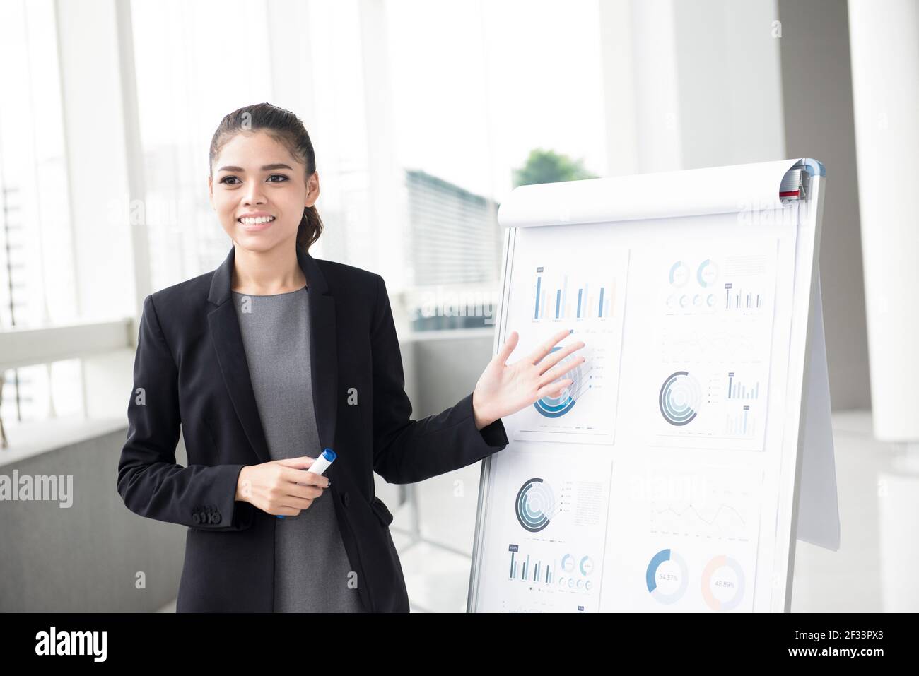 Young businesswoman presenting her work Stock Photo - Alamy