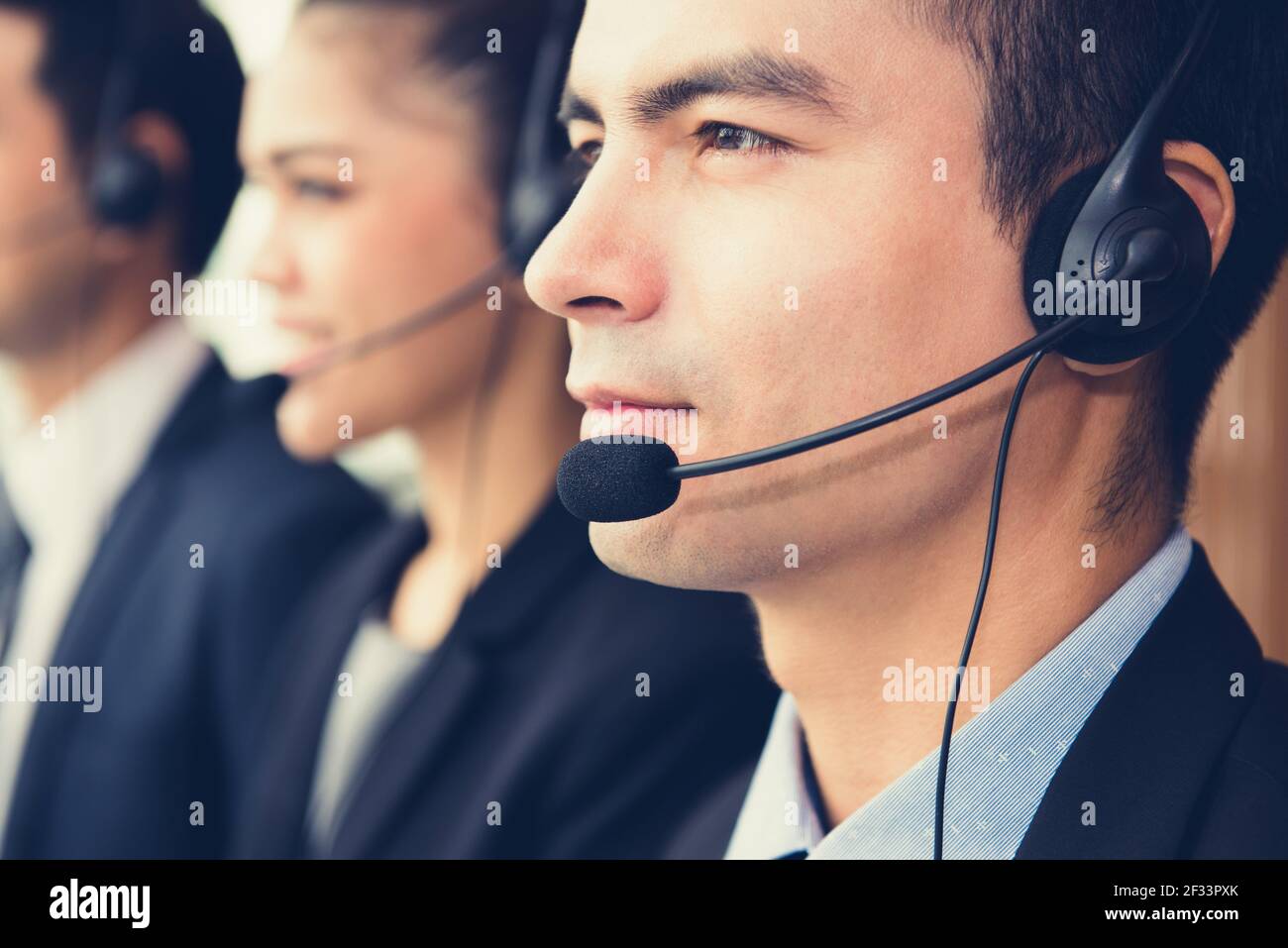Call center (or telemarketer) team Stock Photo - Alamy