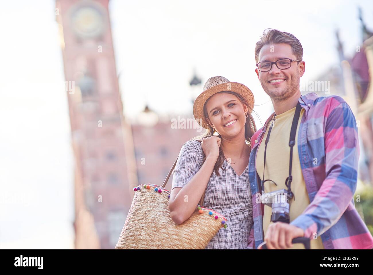 Happy tourists sightseeing during summer holidays Stock Photo - Alamy