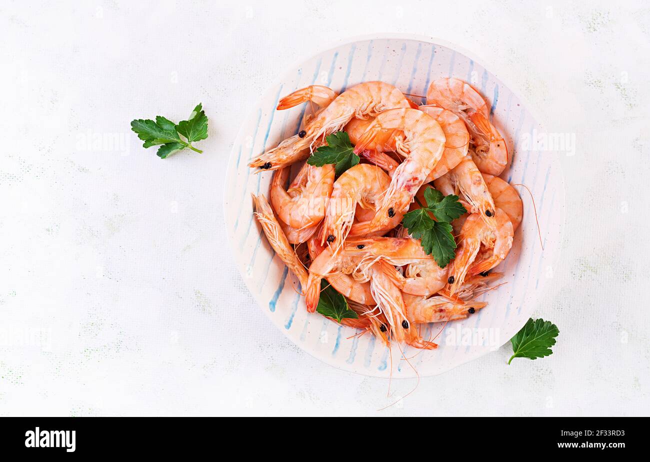 Prawns on bowl. Shrimps, prawns. Whole boiled shrimp. Seafood. Top view ...
