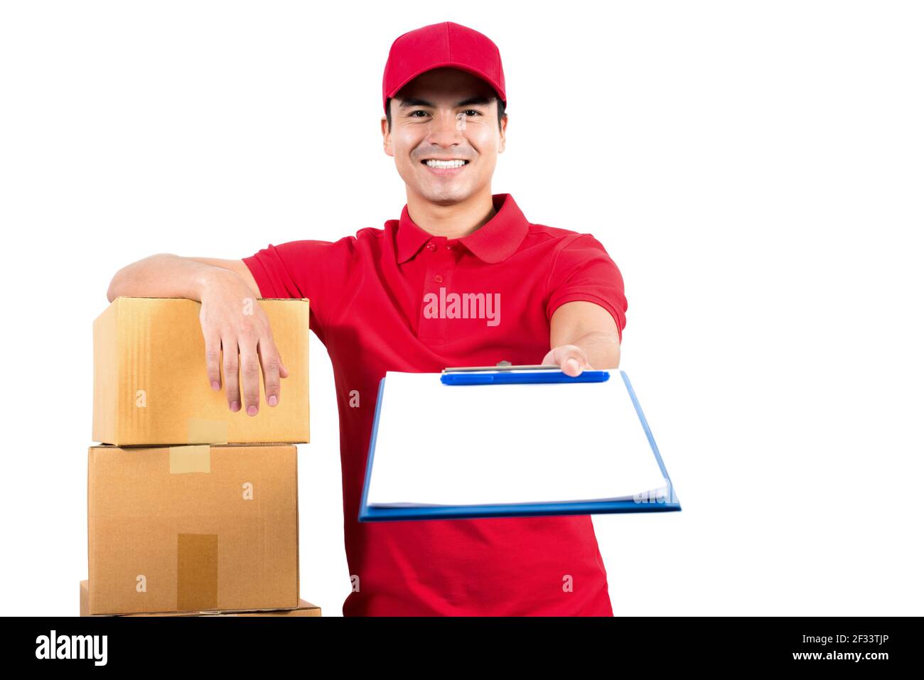 Smiling delivery man giving clipboard for signature Stock Photo - Alamy