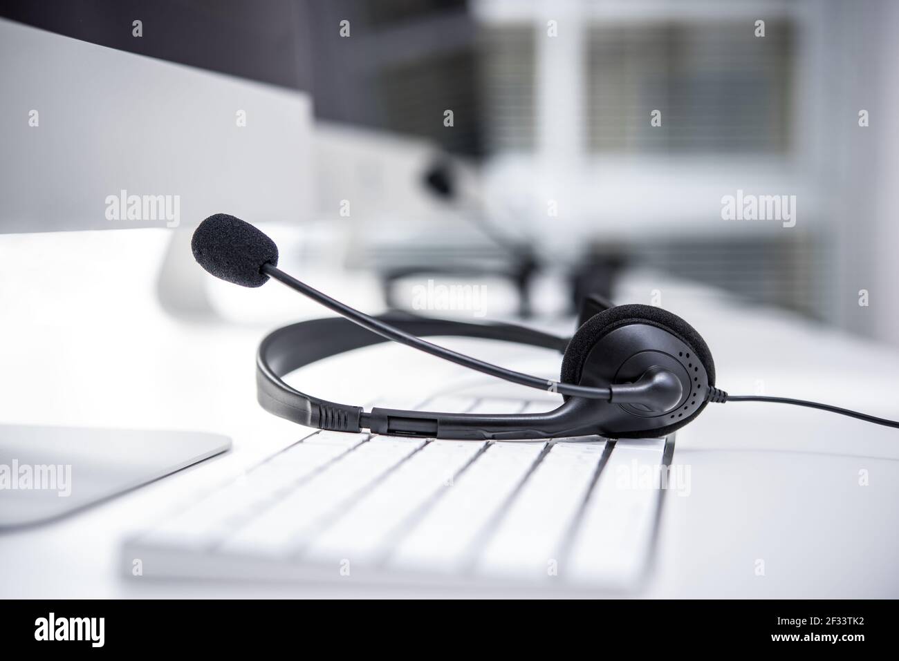Headset with microphone on computer keyboard - call center concept ...