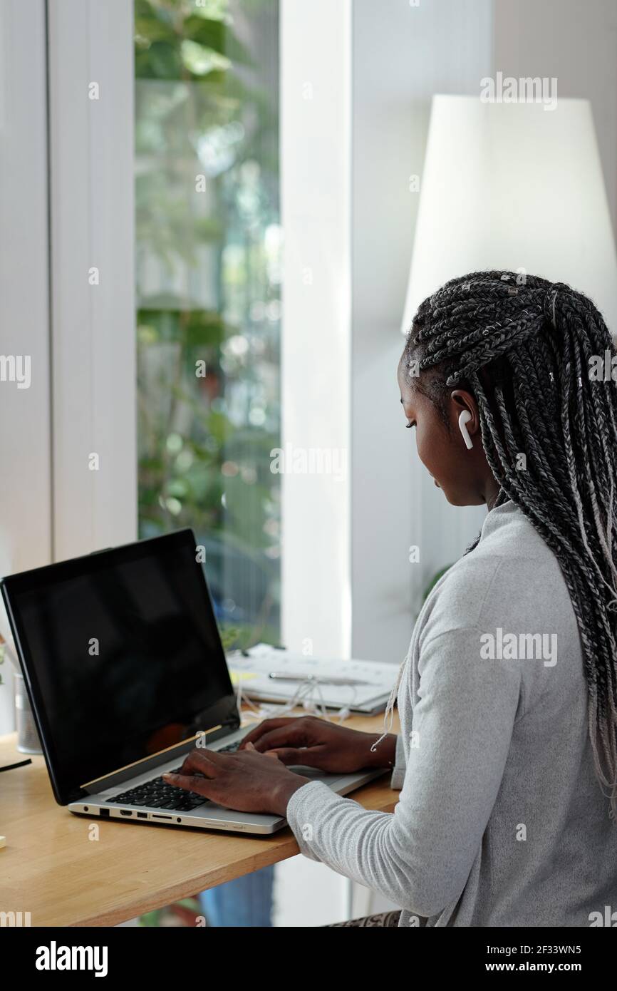 Female university student at desk home hi-res stock photography and ...