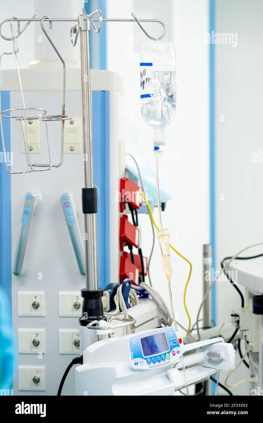Infusion dropper on a medical stand in a surgical operating room ...