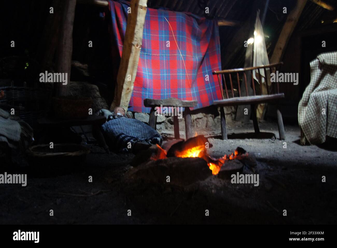 Inside an old farmhouse with a campfire inside Stock Photo - Alamy