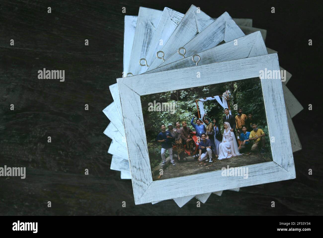 hand crafted photo frame with artistic dull white paint forming a ...