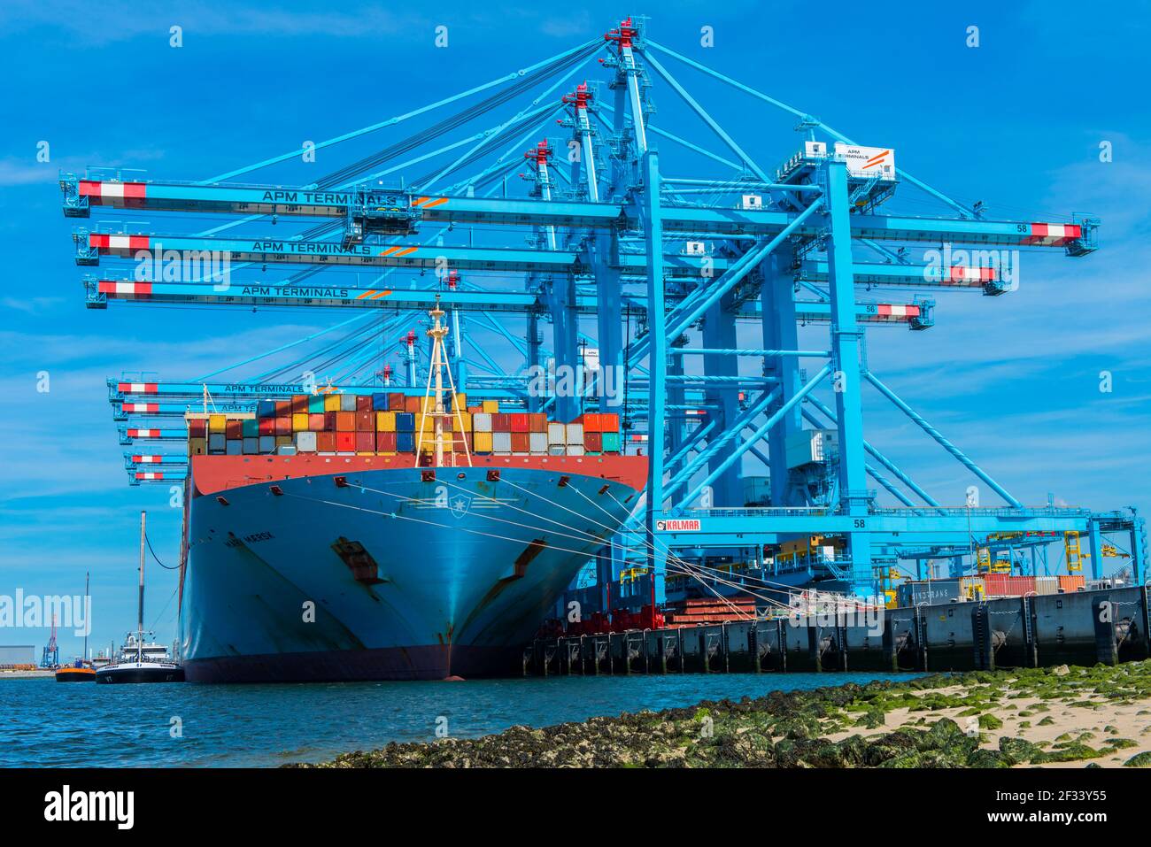 Rotterdam, Netherlands. Very large container ship and vessel moored at ...