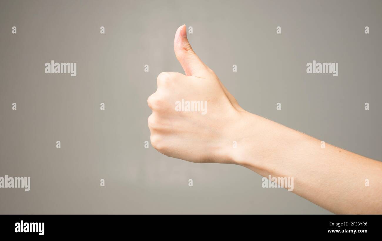 Female hands thumbs up Stock Photo - Alamy