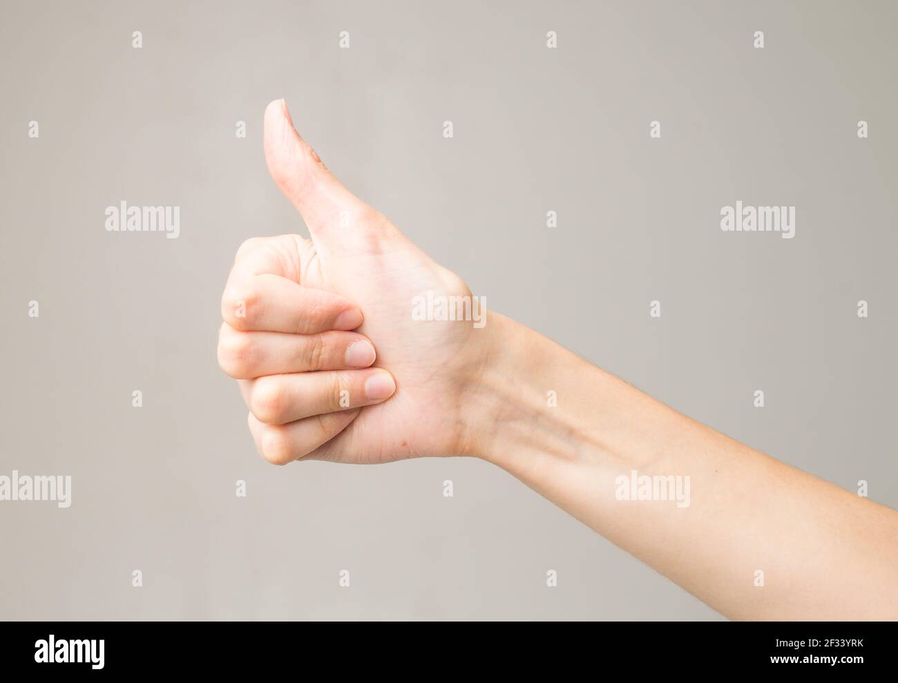 Female hands thumbs up Stock Photo - Alamy