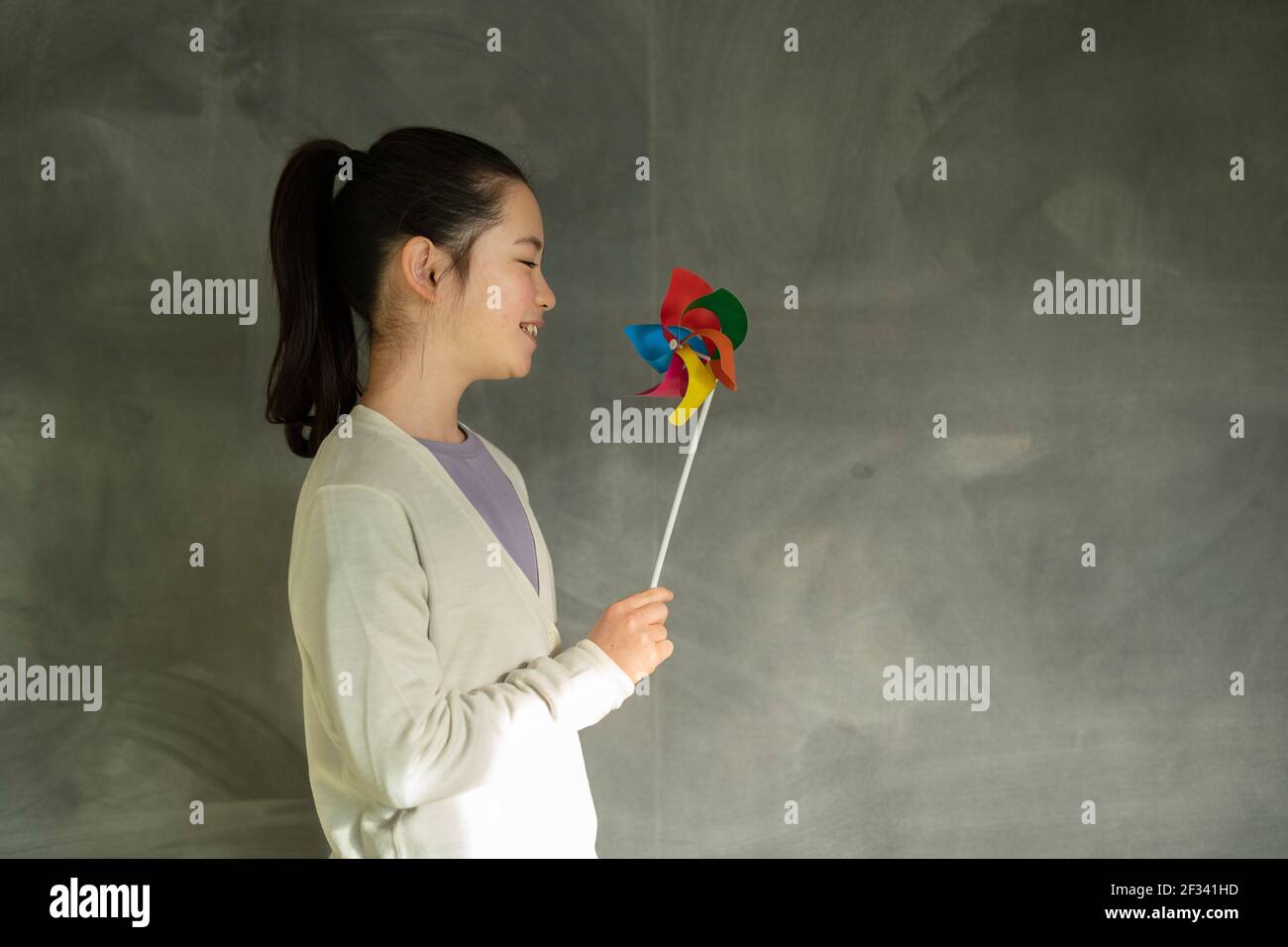 Girl Having Pinwheel Stock Photo - Alamy