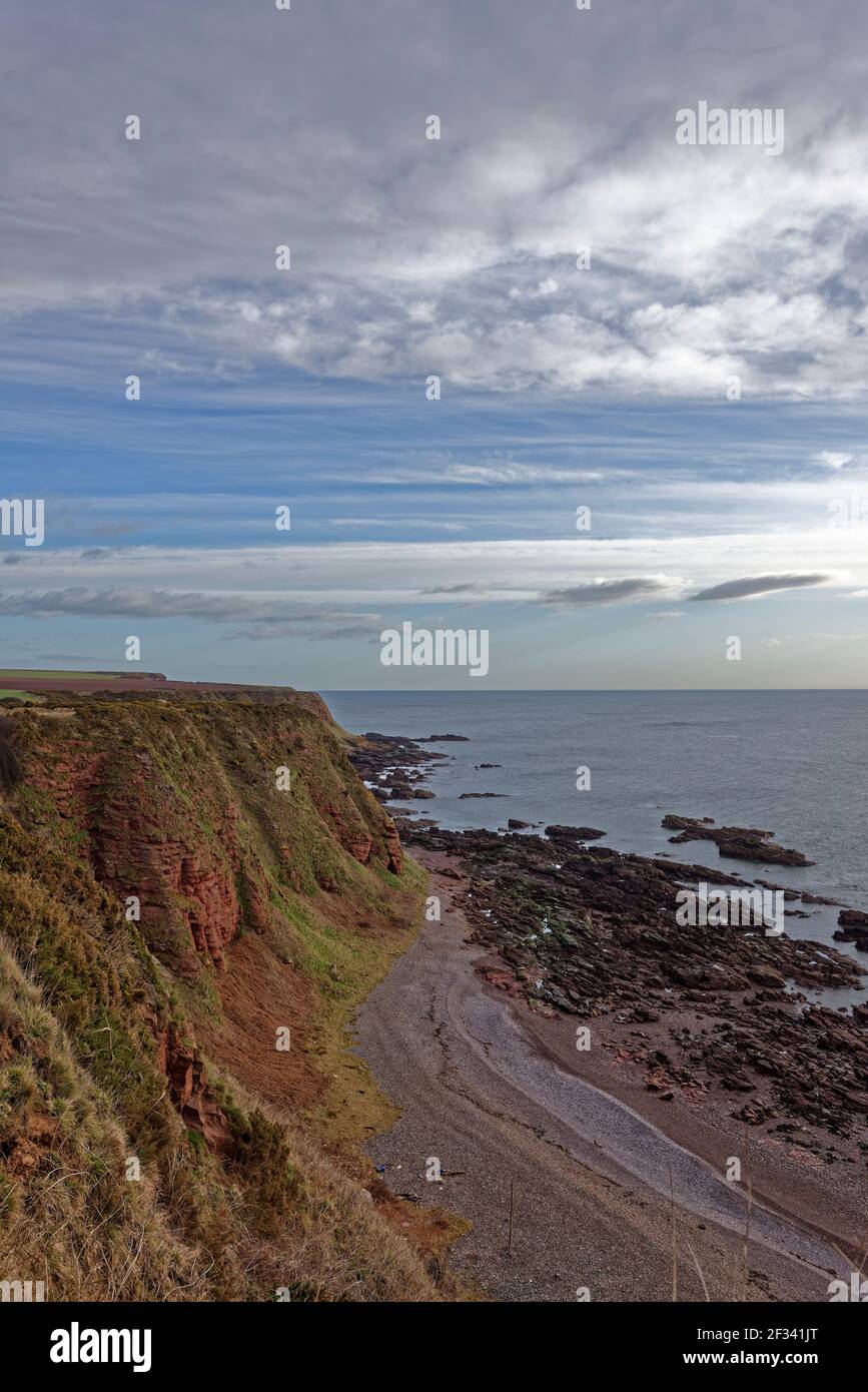 The inaccessible small Narrow shingle beach at Rumness with its Rocky ...