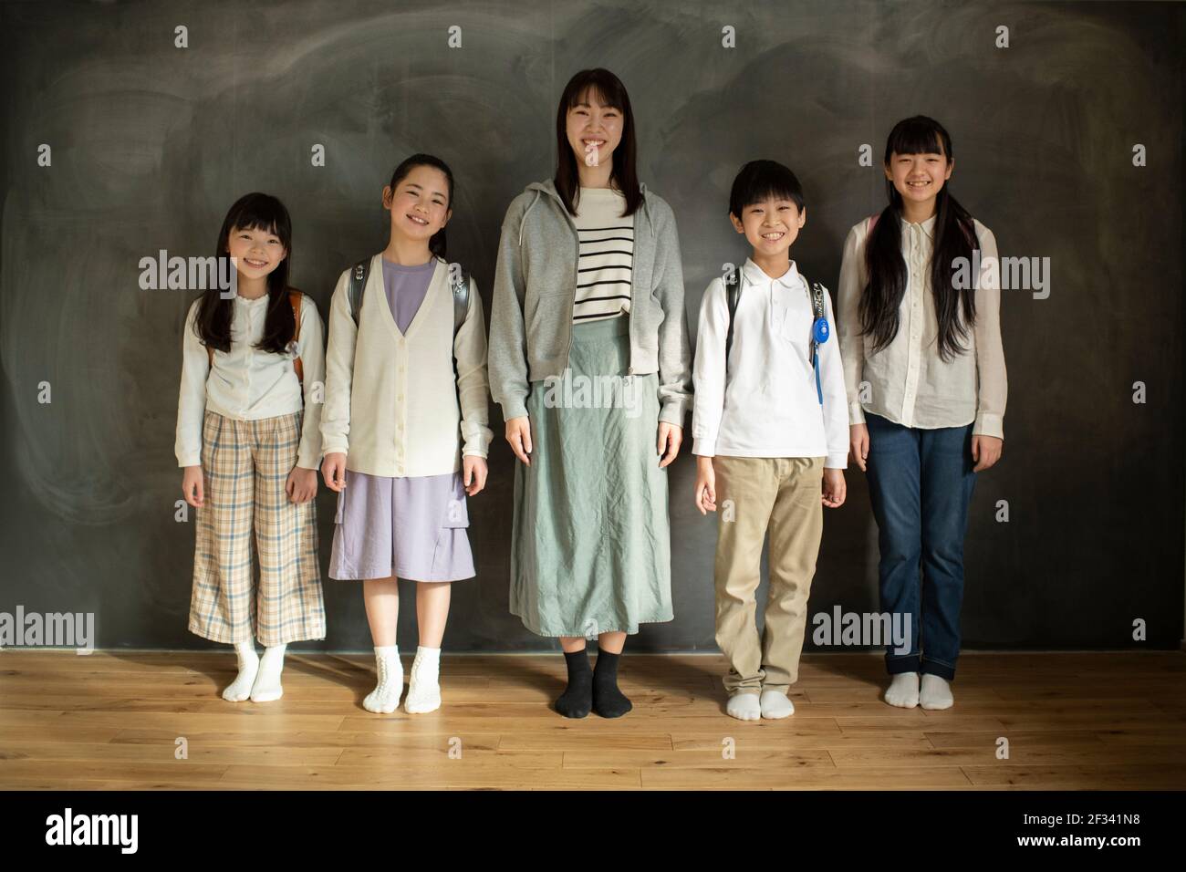 Elementary School Students and Teacher Standing in Line Stock Photo - Alamy