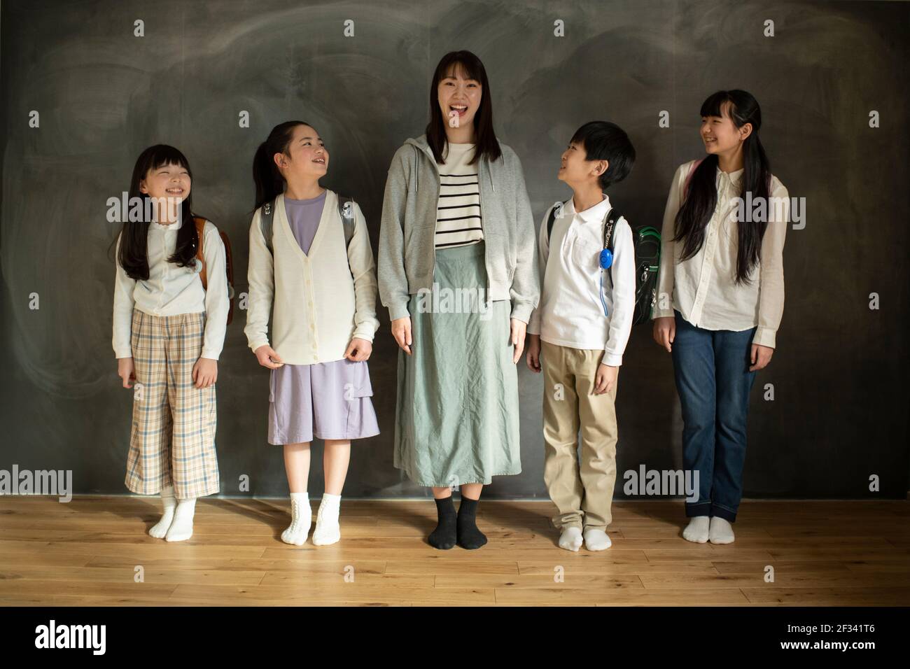Elementary School Students and Teacher Standing in Line Stock Photo - Alamy