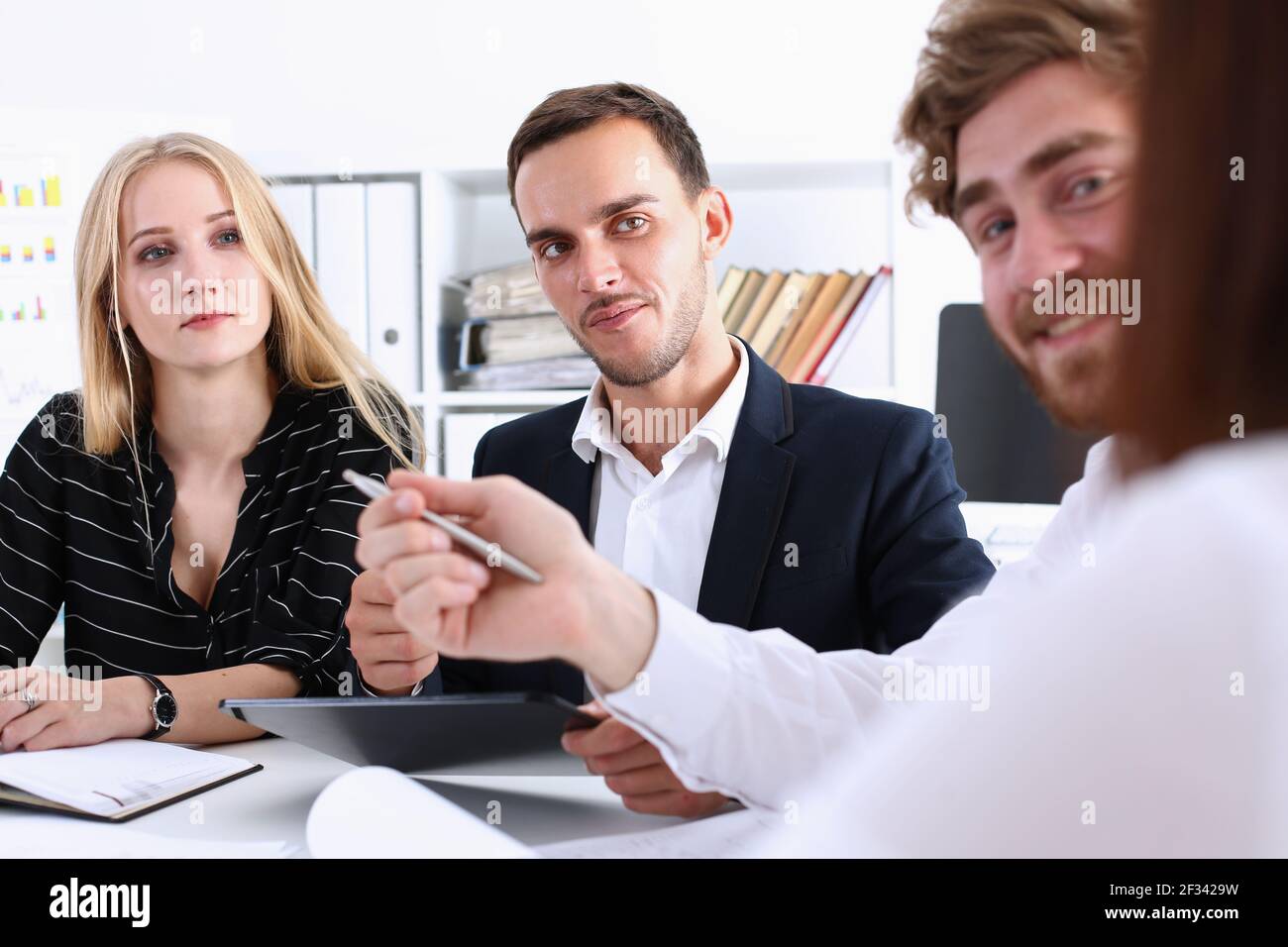 Group of people sit in office deliberate on problem Stock Photo - Alamy