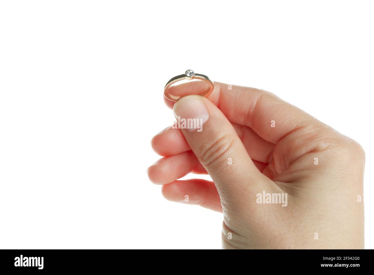 Female hand hold ring, isolated on white background Stock Photo - Alamy
