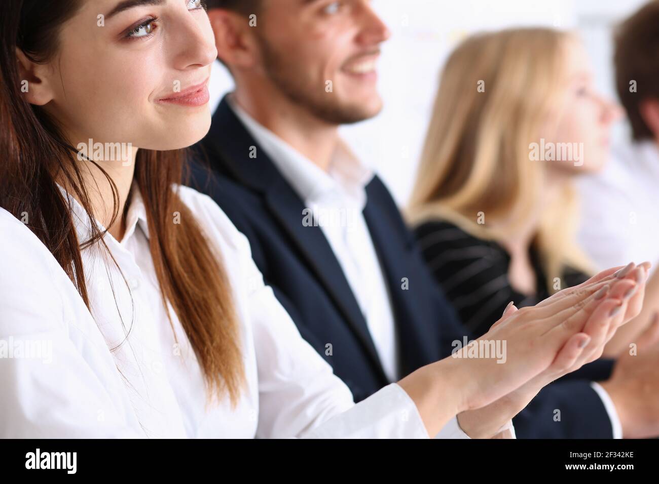Group of people clap their arm in row Stock Photo - Alamy