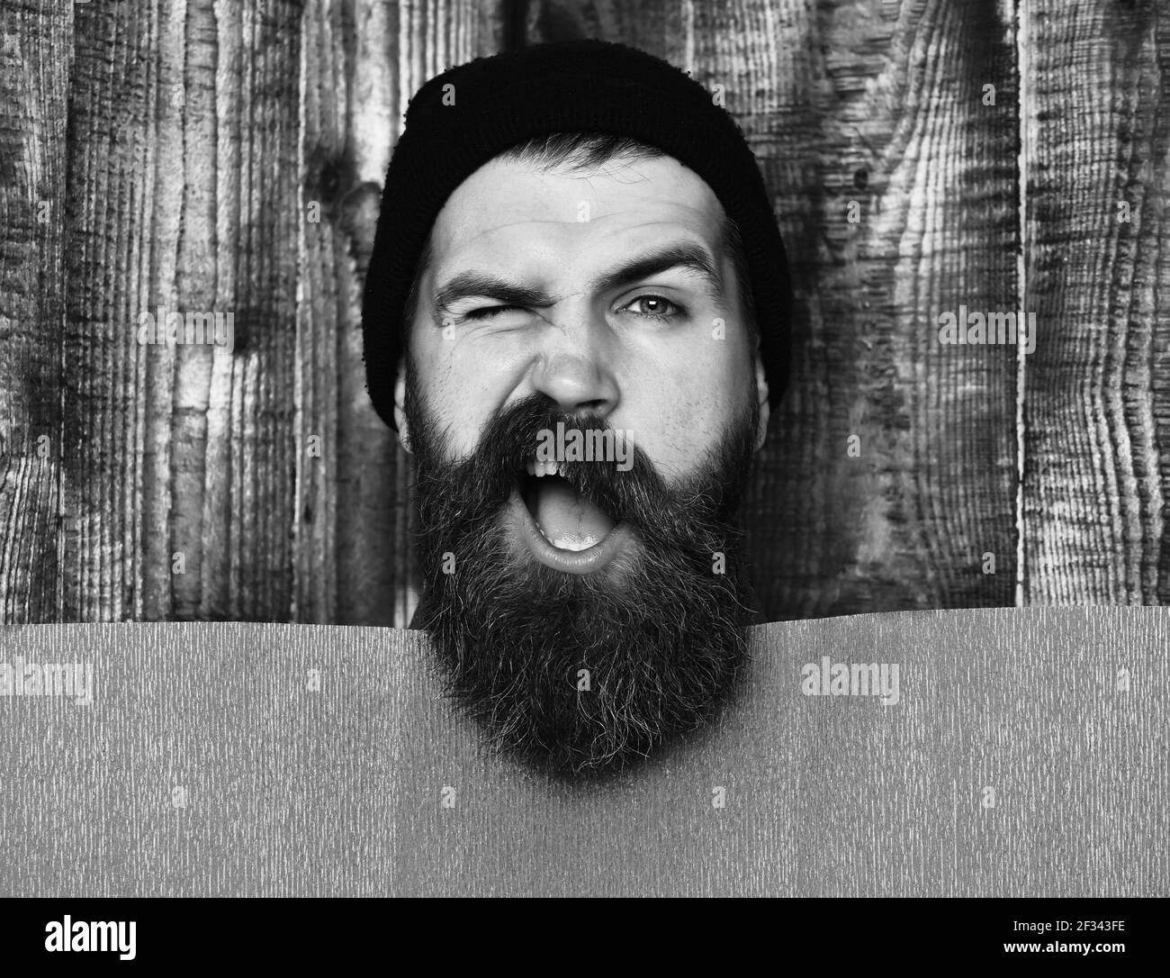 Bearded brutal caucasian hipster with red paper sheet Stock Photo - Alamy