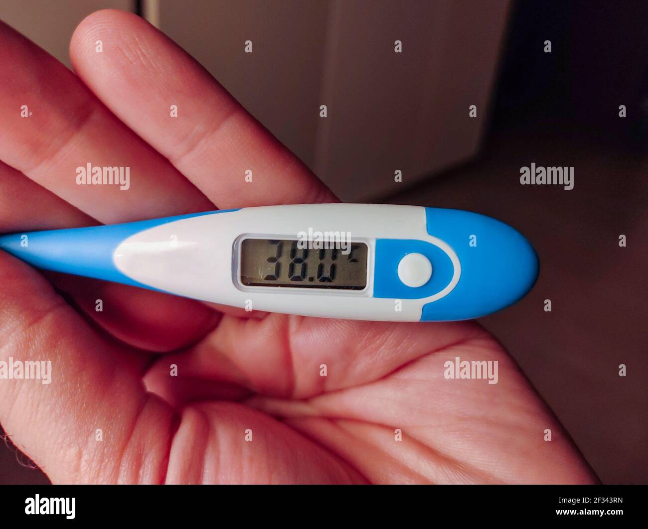 Thermometer indicating the flu temperature Stock Photo - Alamy