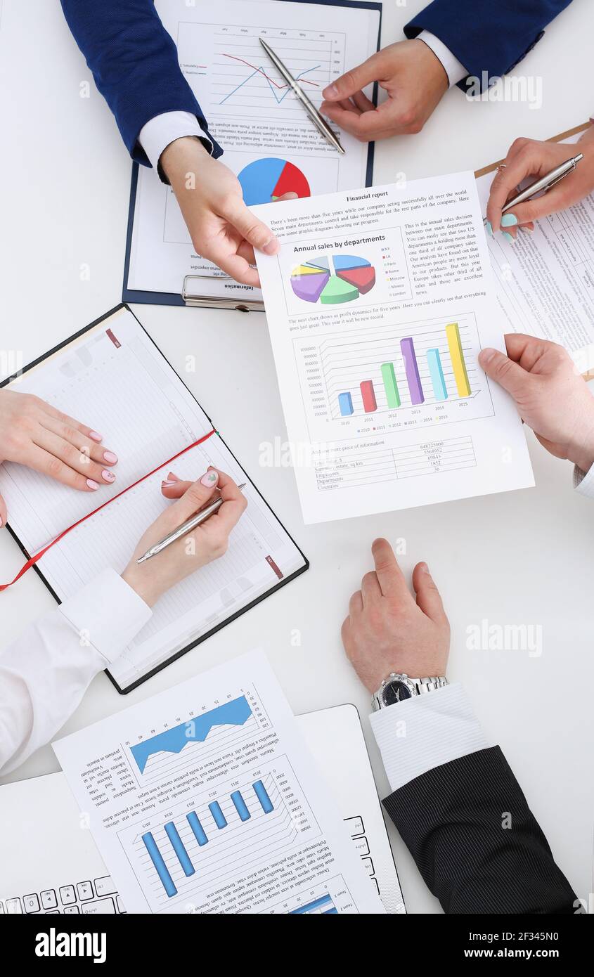 Group of people discuss plan at workplace closeup Stock Photo - Alamy